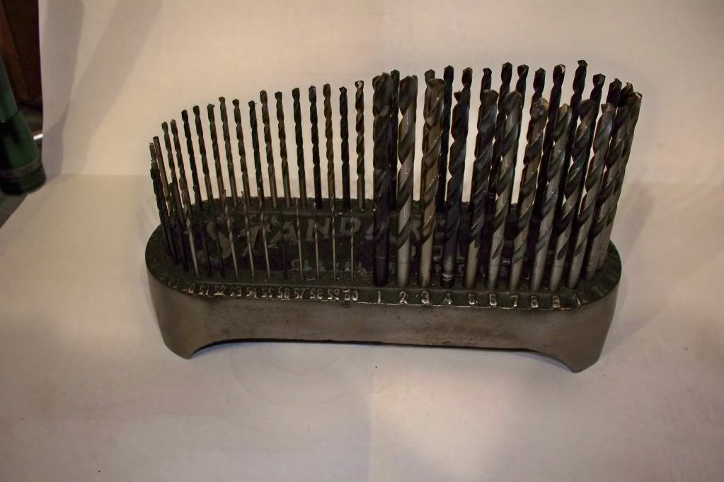 Cast metal drill bit stands